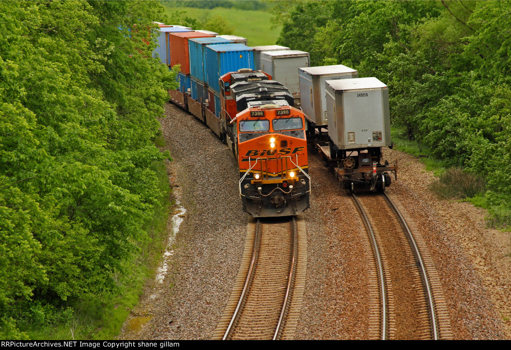 BNSF 7396 Heads WB passing a EB z train.